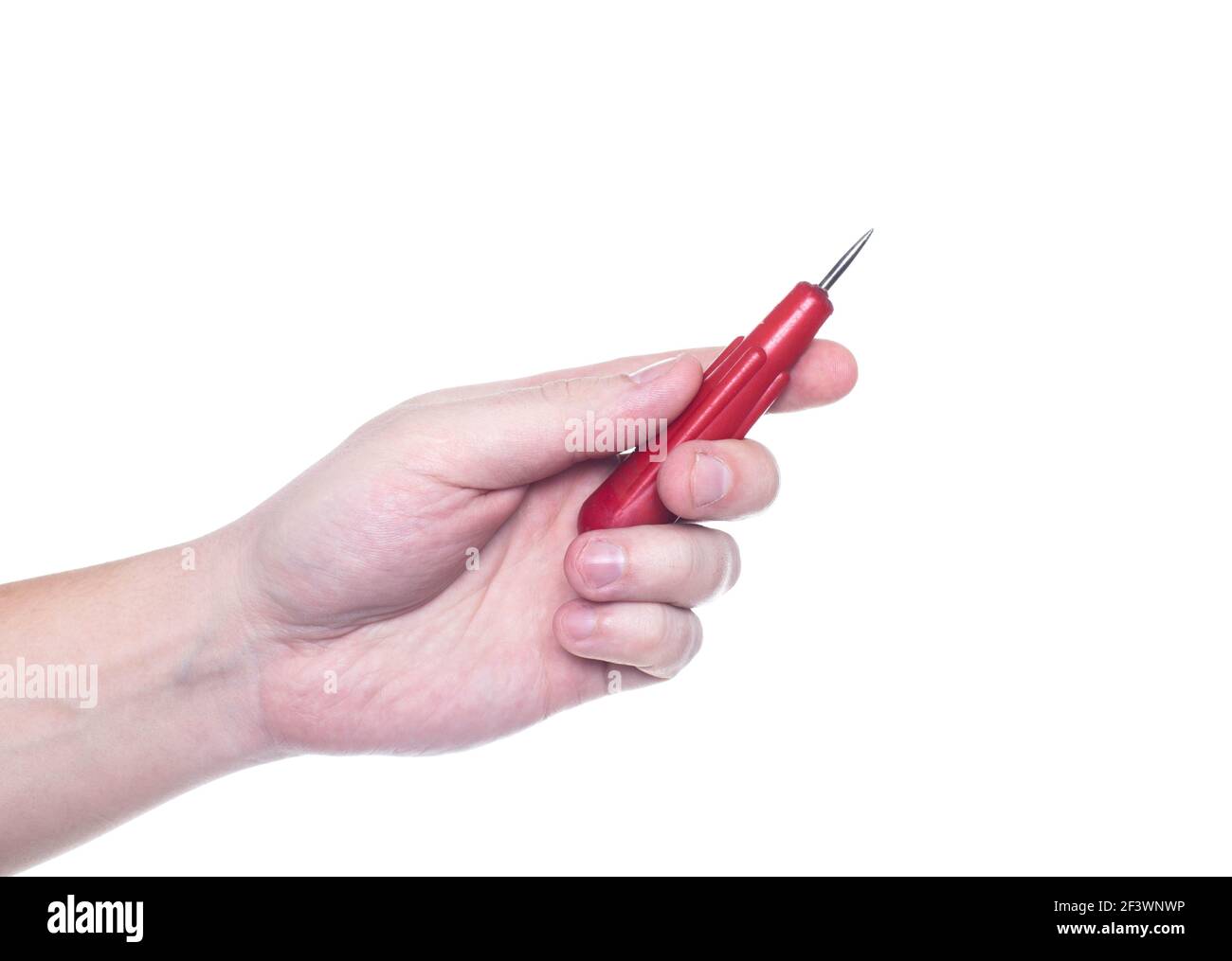 Man holds an awl in his hand on a white background, isolate. Close-up ...