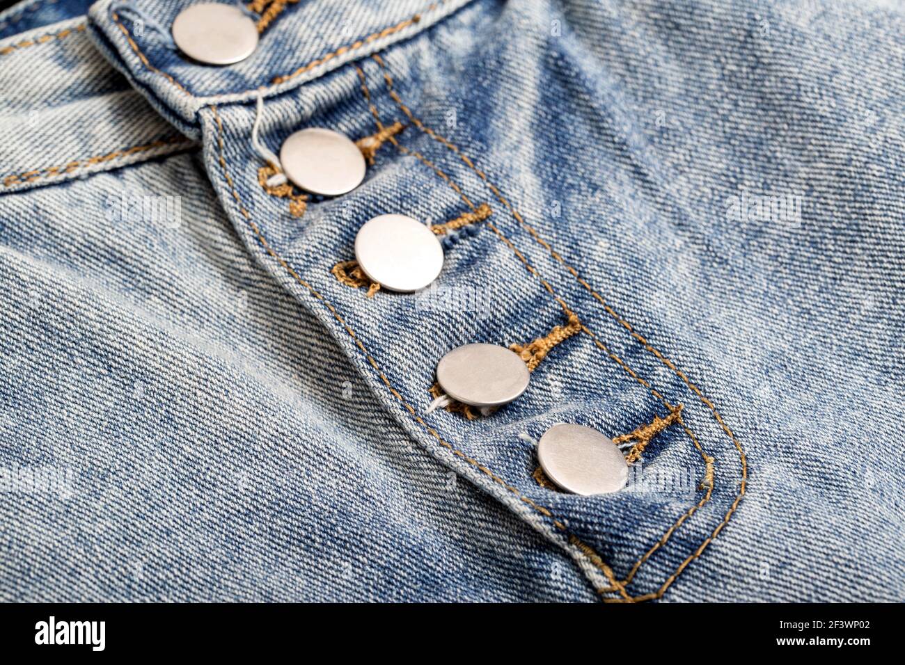 Stylish buttons on a trendy denim skirt, background, macro. Vintage ...