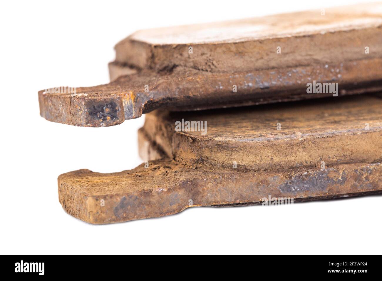 Old worn out brake pads from a car on a white background, isolate ...