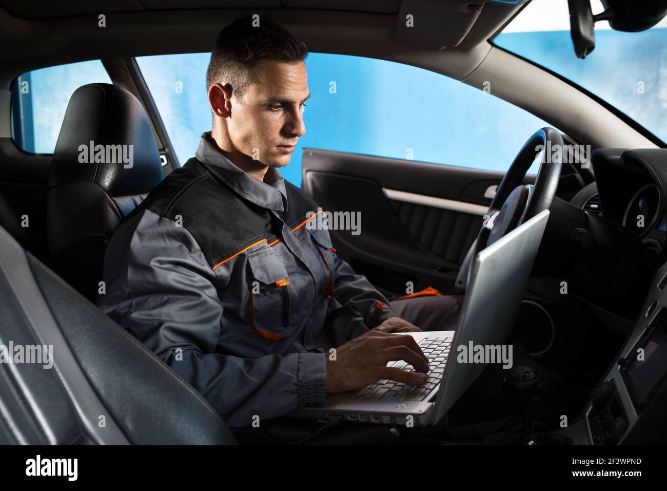 Mechanical check the car electronics with laptop, using diagnostic ...