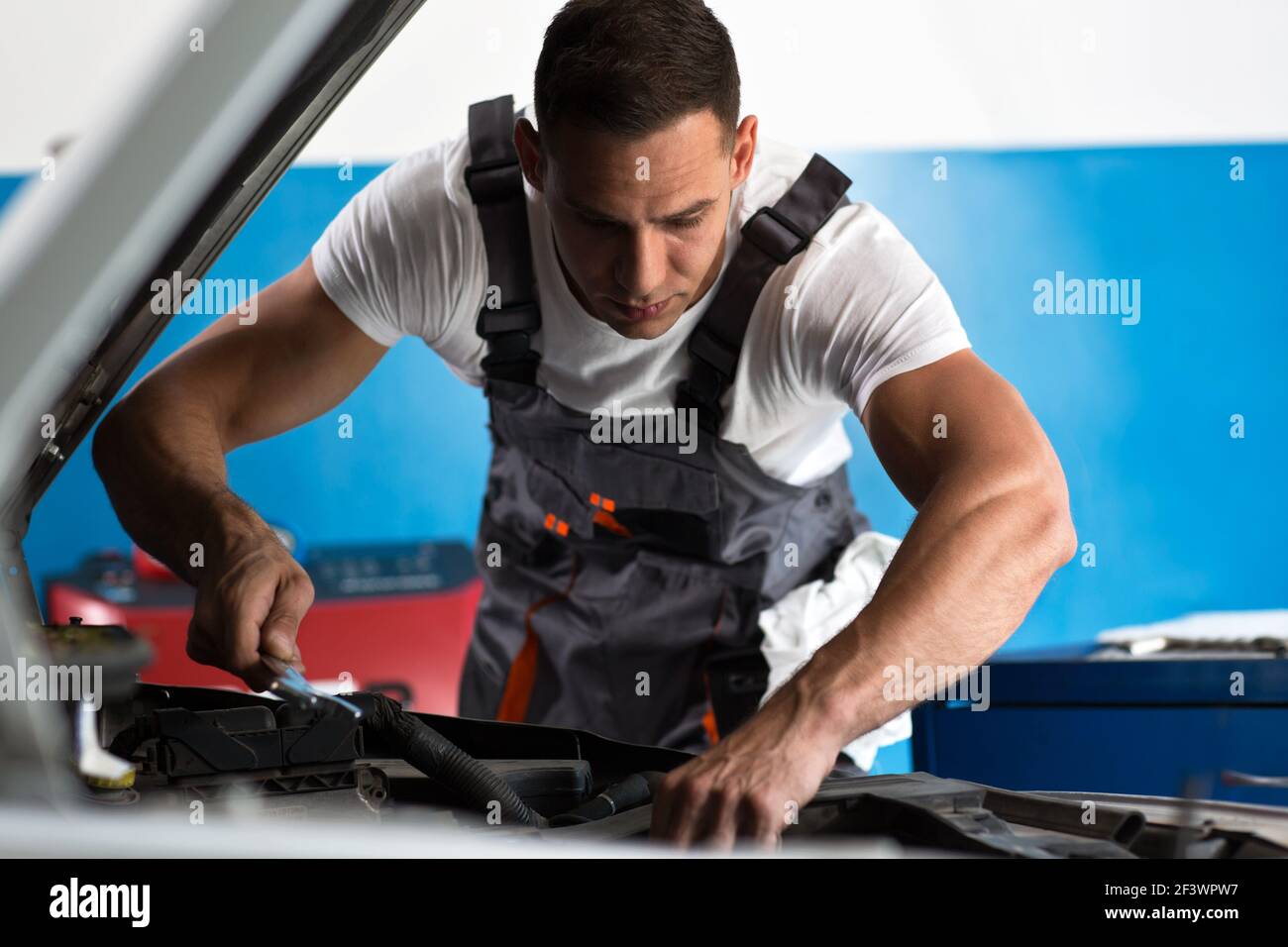 Mechanic man repairing car hi-res stock photography and images - Alamy