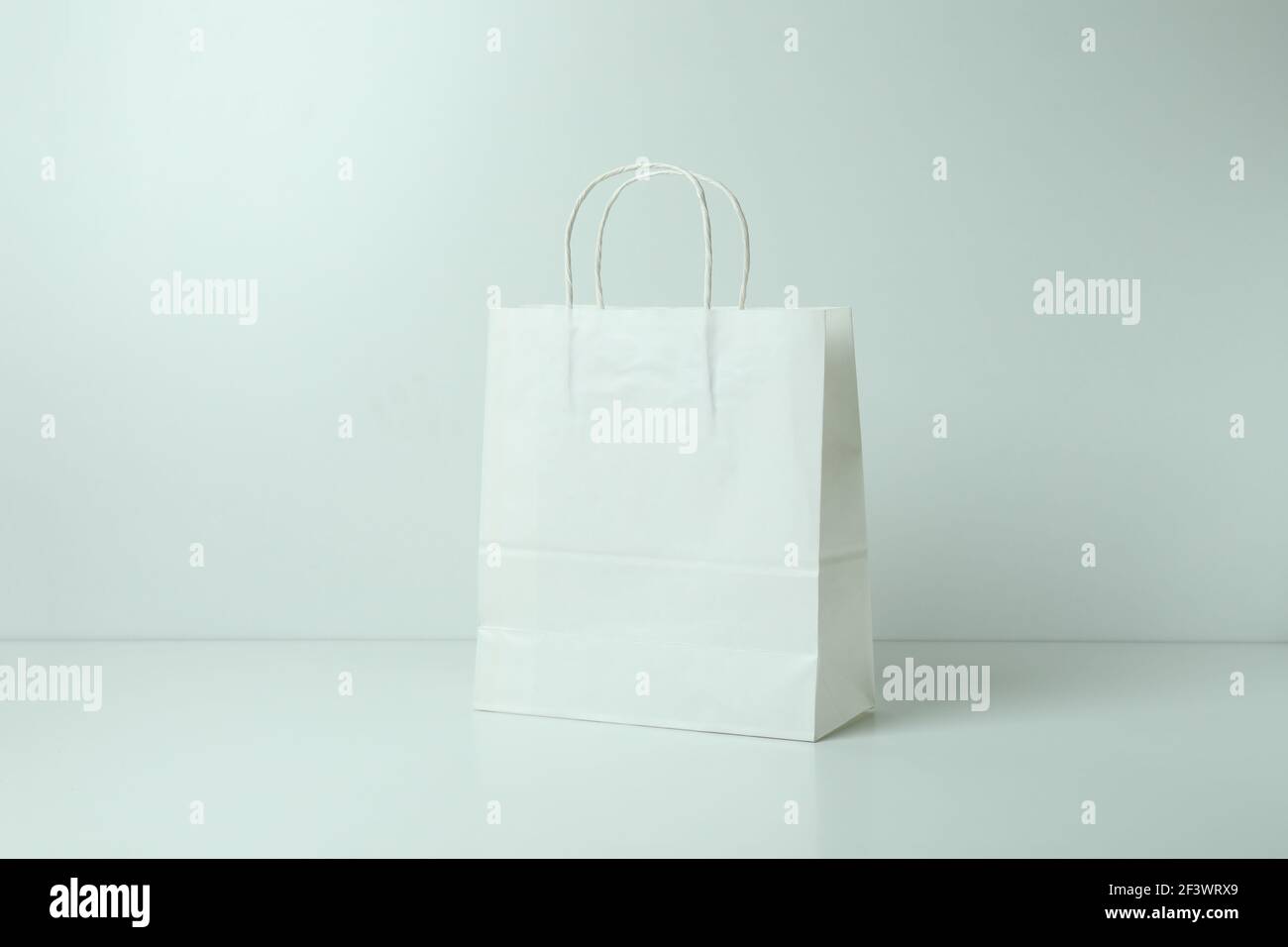 Paper bag on white background, space for text Stock Photo - Alamy