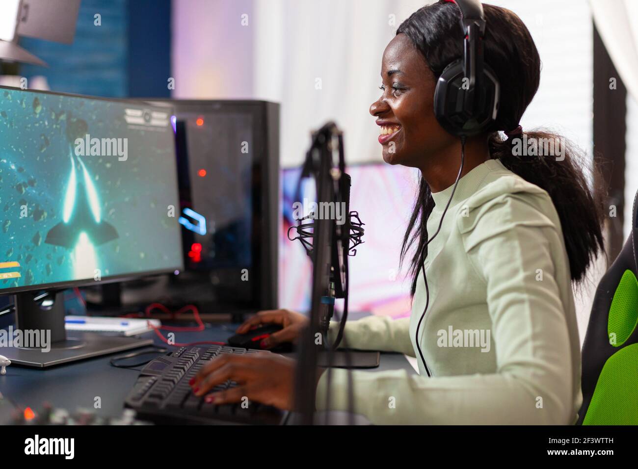 Competitive e-sport professional gamer player talking into microphone ...