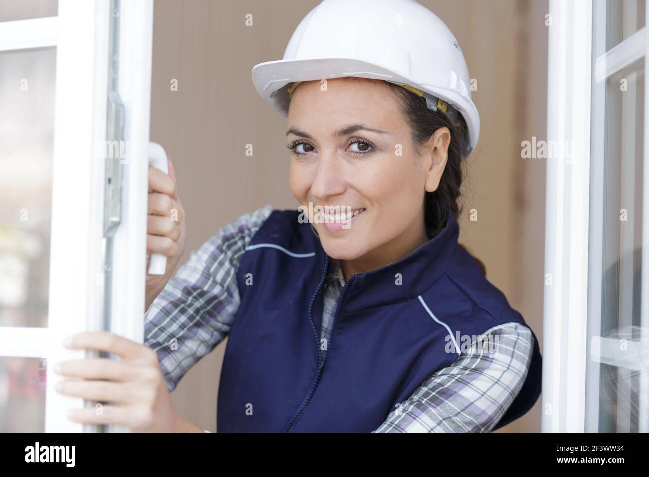 Builder through window hi-res stock photography and images - Alamy