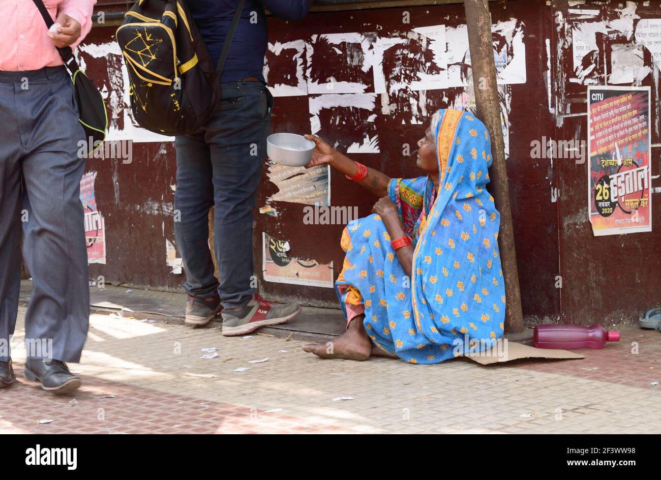 Old elderly Homeless woman begging in the city street corner of Kolkata ...
