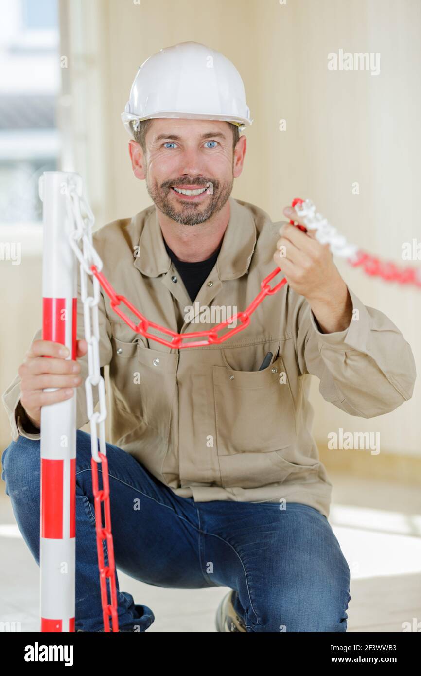 portrait of smiling builder wearing uniform Stock Photo - Alamy