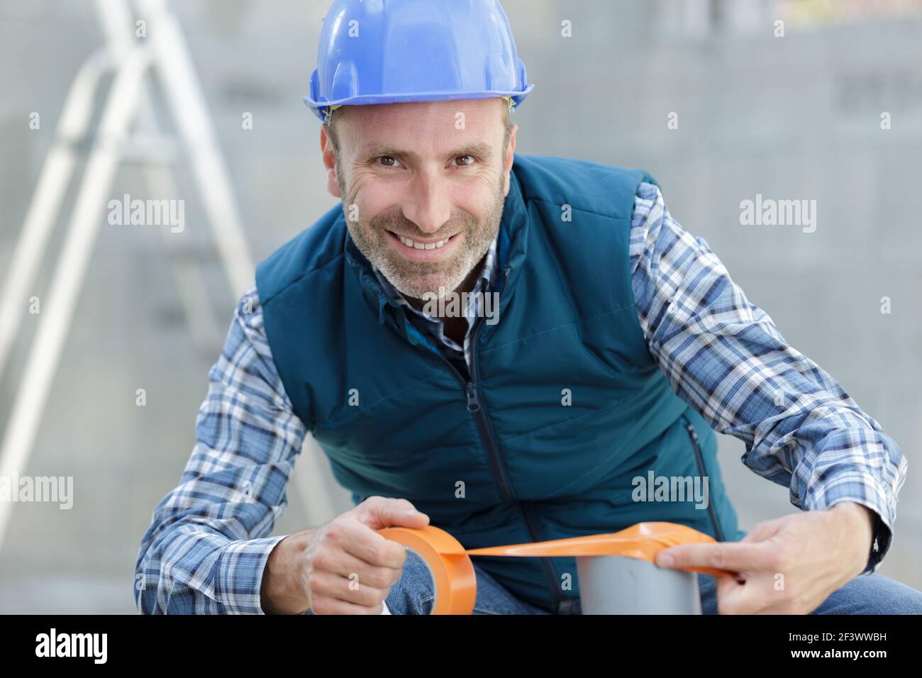 worker man working with steel pipes Stock Photo - Alamy