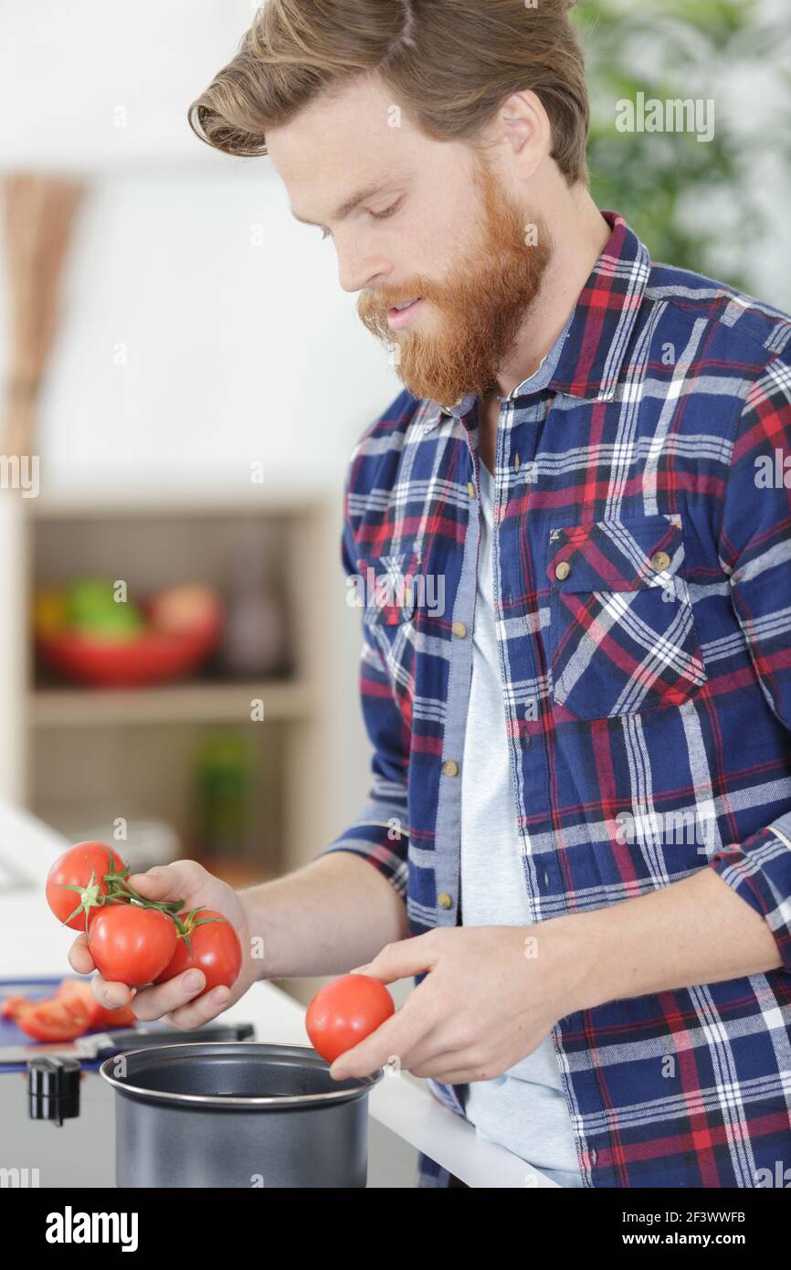 Young happy european cook hi-res stock photography and images - Alamy