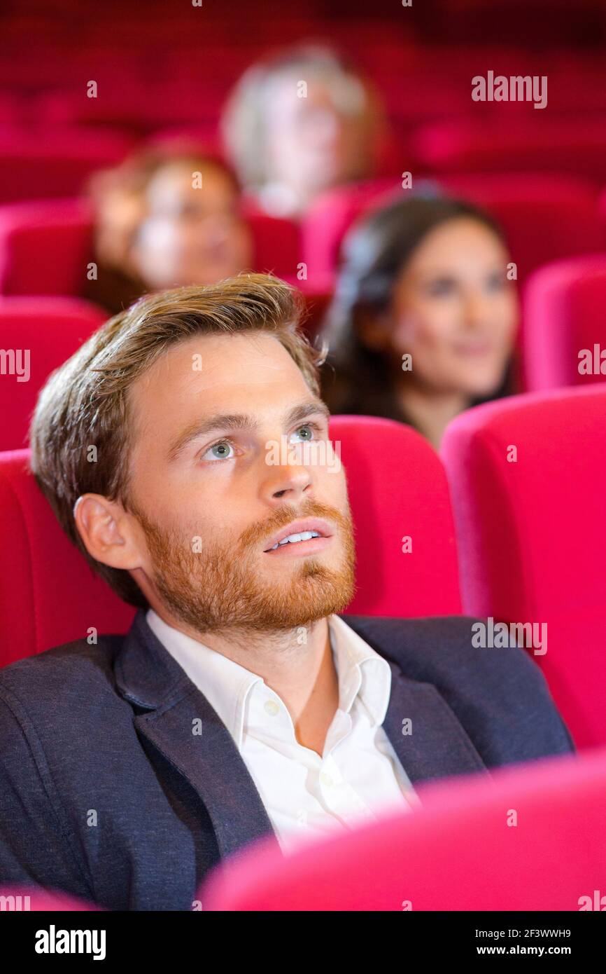 a young man watching movies Stock Photo - Alamy
