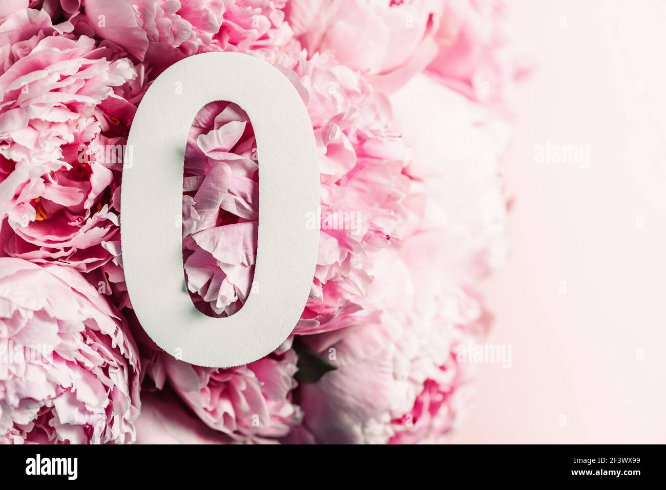 Creative layout. Pink peony flowers and number zero 0. Birthday ...