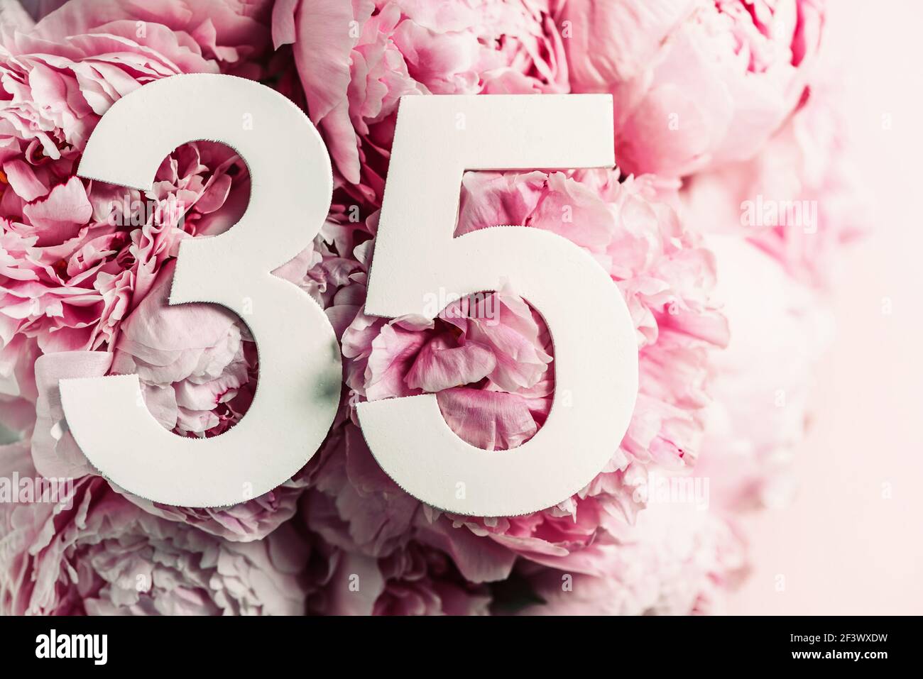 Peony flowers, digit thirty-five. Birthday greeting card with ...