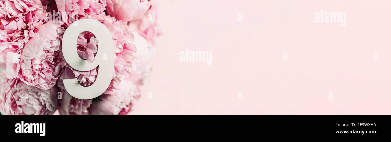 Creative layout. Pink peony flowers and digit nine 9. Birthday greeting ...