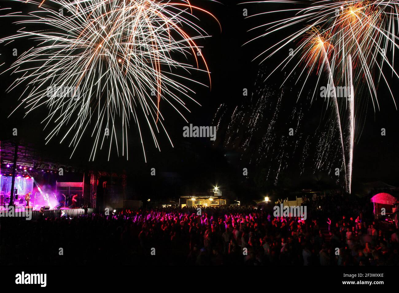 Beautiful fireworks during an outdoor concert Stock Photo - Alamy