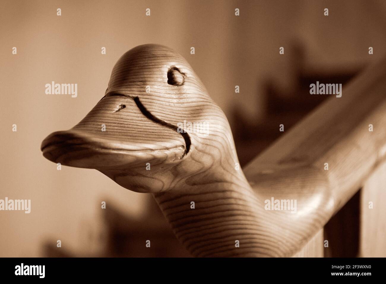 hand-carved handrail finish in wood in the shape of an animal. Hand ...