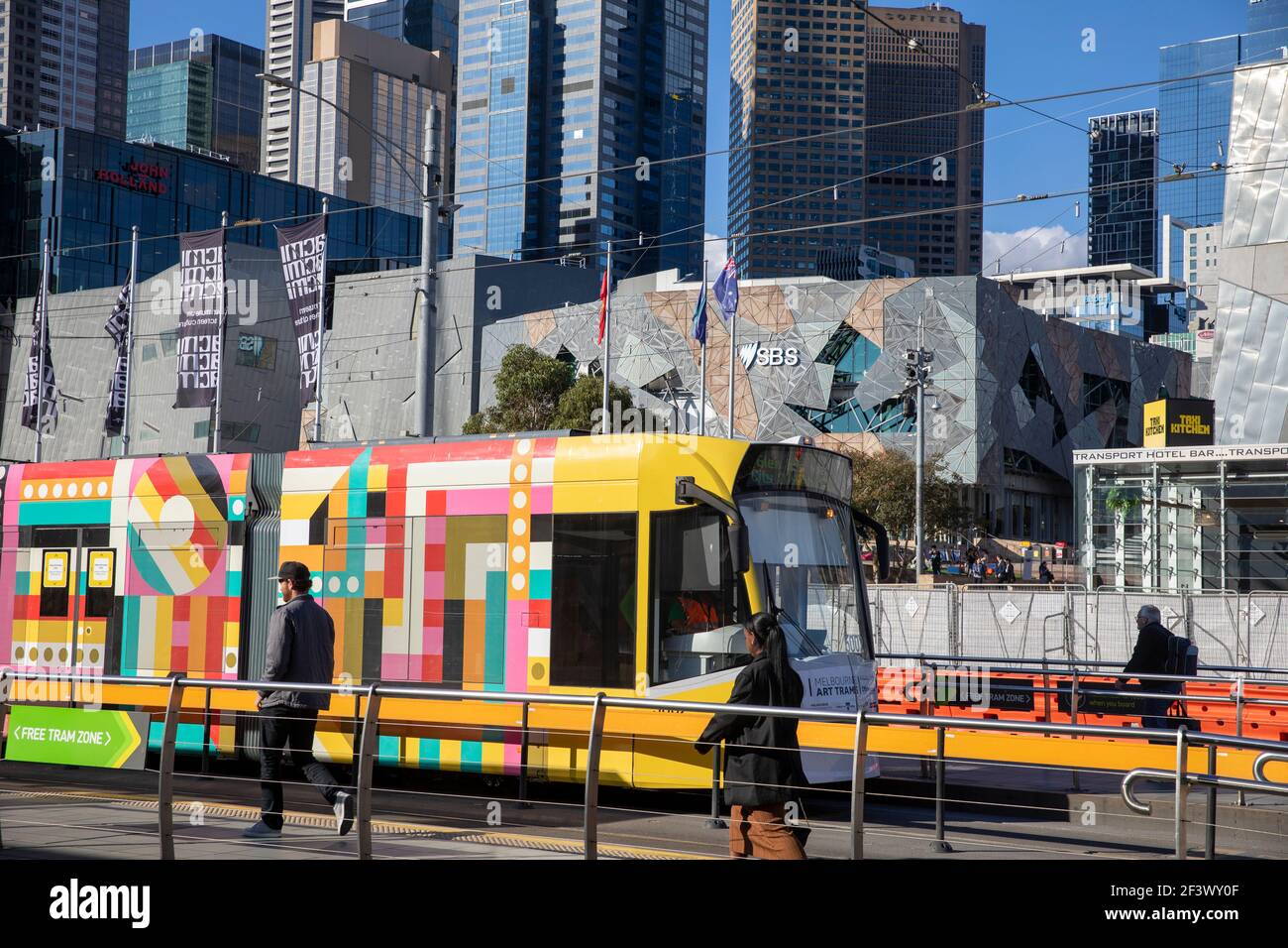 Melbourne tram in the city centre on Princes bridge next to Federation ...