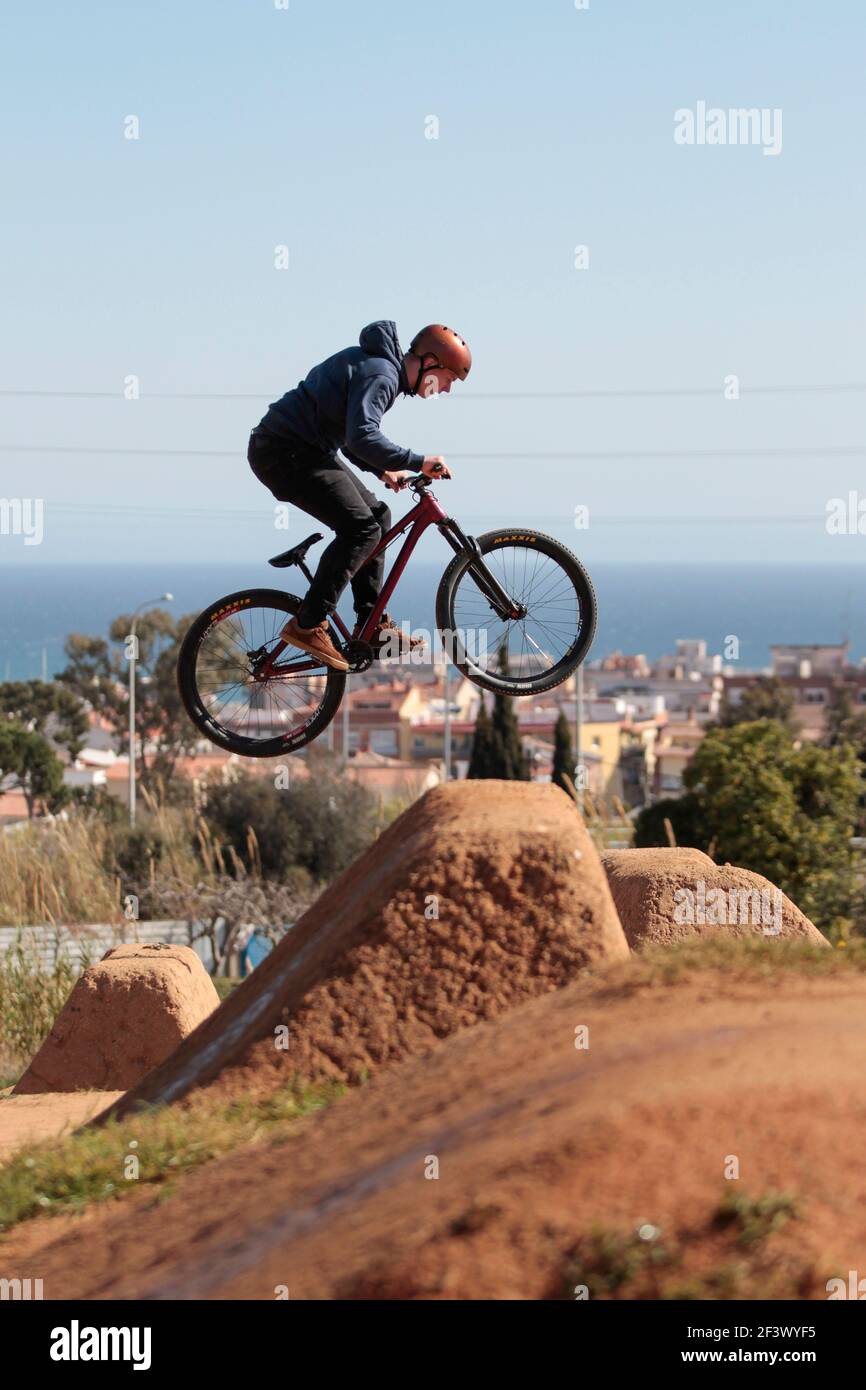 Dirt bike rider performing jumps at La Poma Bike Park near Barcelona ...