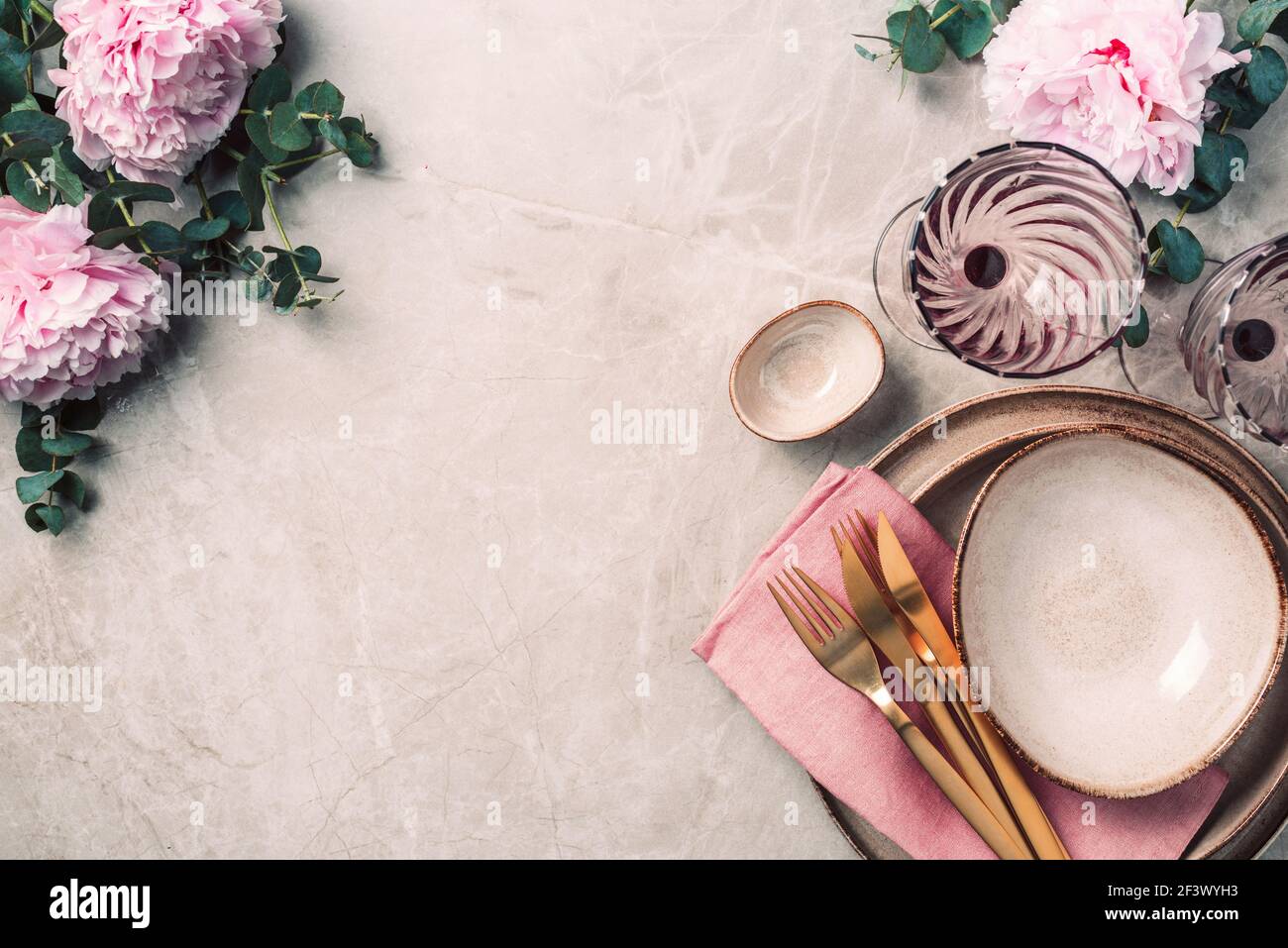 Tableware, flowers for serving a festive table, dinner. Stoneware ...