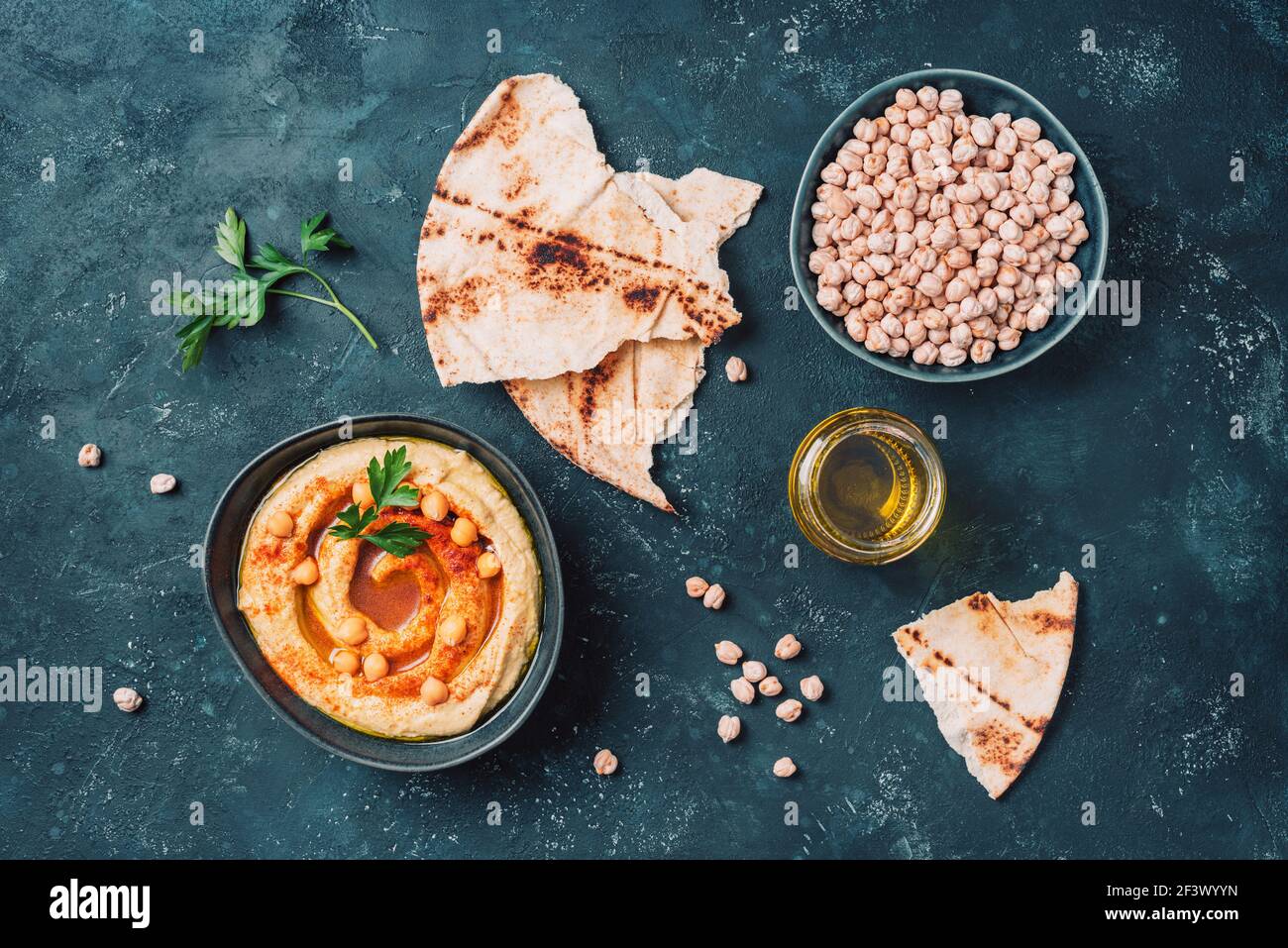 Chickpeas hummus, olive oil, raw chickpeas, smoked paprika, pita on ...