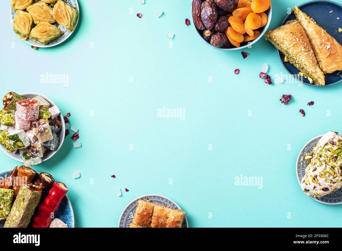 Middle Eastern sweets on blue background. Arab dessert, baklava, halva ...