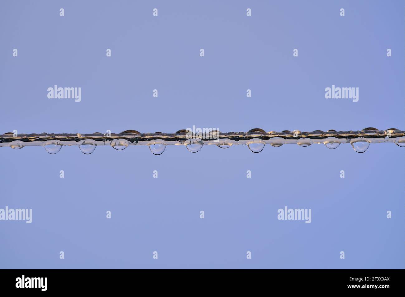 Drops of water on clothes line hi-res stock photography and images - Alamy