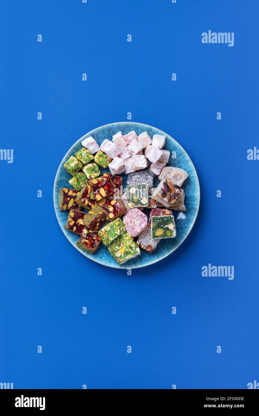 Middle Eastern sweets. Turkish delight with pistachios nuts on plate ...