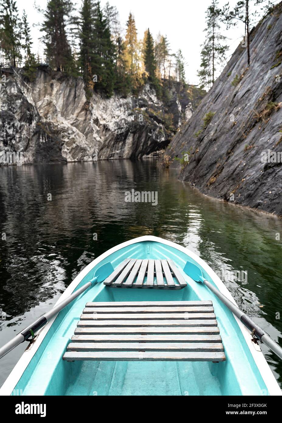 White and turquoise boat in mountain lake natural background. Mountain ...