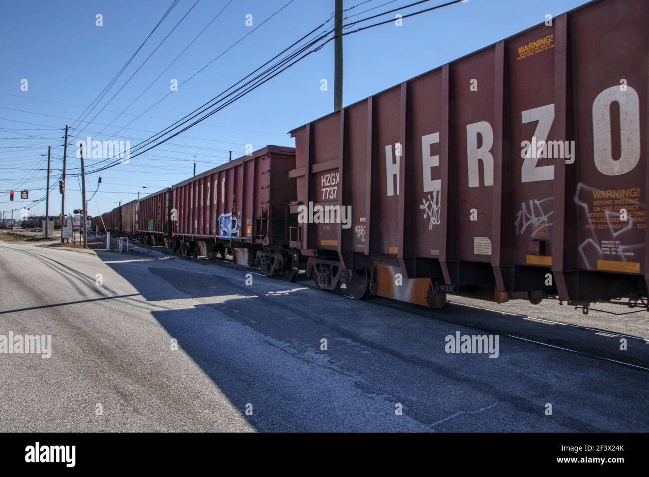 Augusta, Ga USA - 02 21 21: A long cargo train and clear blue sky red ...