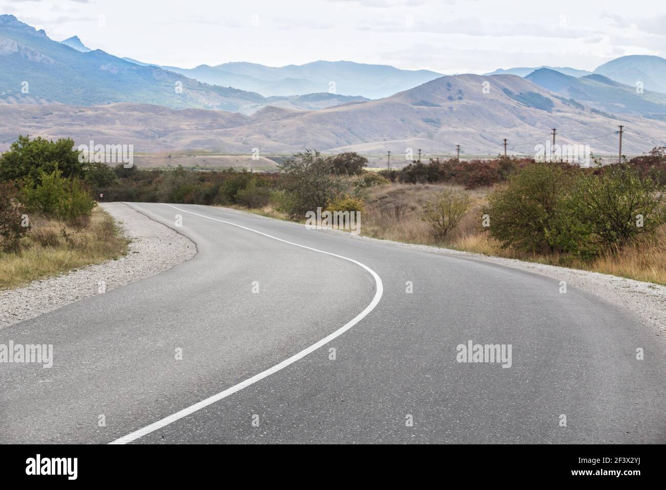 Winding asphalt road hi-res stock photography and images - Alamy
