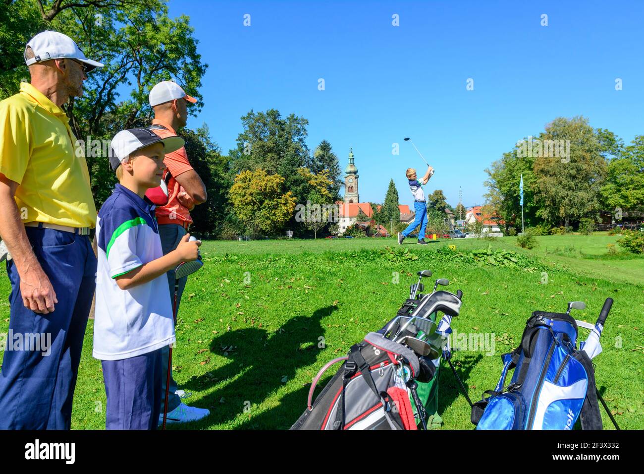 A group of golfers is relaxed on the fairway. Golf, a communicative ...