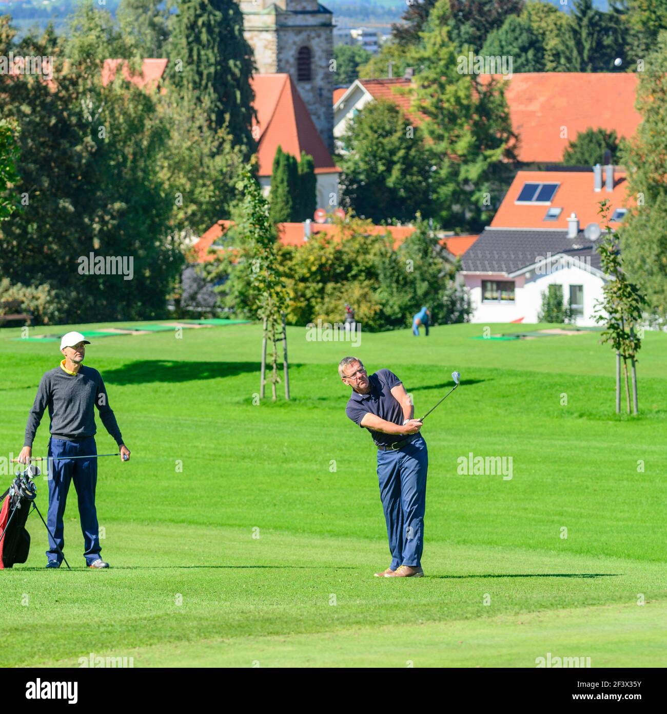 A group of golfers is relaxed on the fairway. Golf, a communicative ...