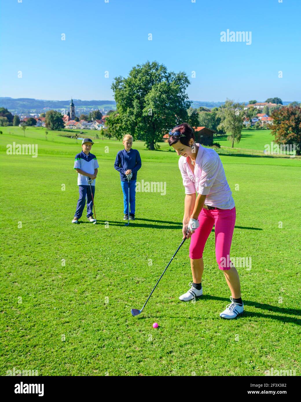 A group of golfers is relaxed on the fairway. Golf, a communicative ...