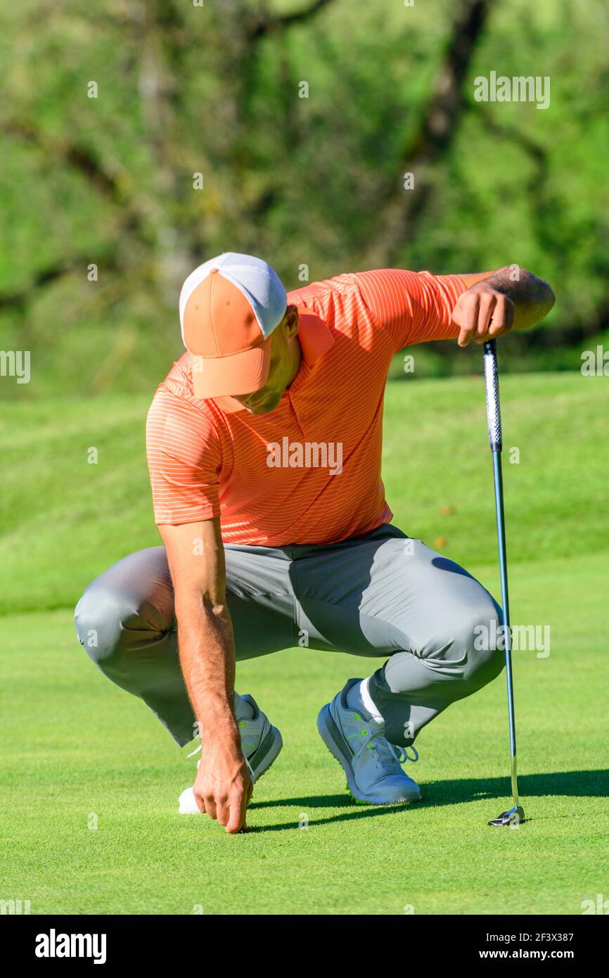 Man playing golf Stock Photo - Alamy