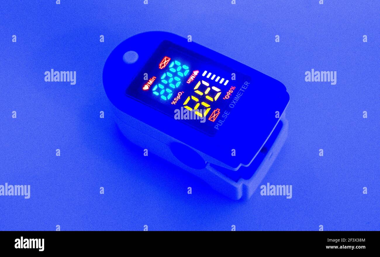 pulse and oximeter medical device on black background Stock Photo - Alamy