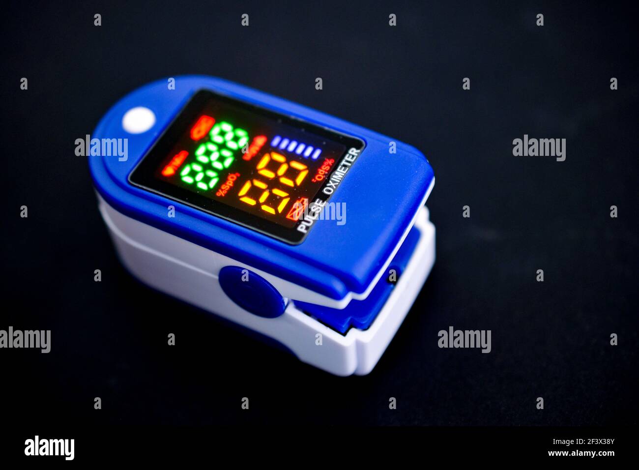 pulse and oximeter medical device on black background Stock Photo - Alamy