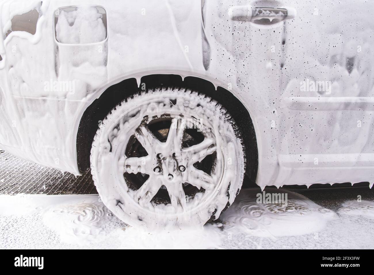 Car covered with washing foam at contactless car washing service Stock ...