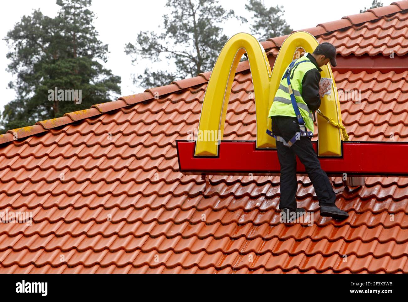 Someone washing Mc Donald's logo at a hamburger restaurant Stock Photo ...