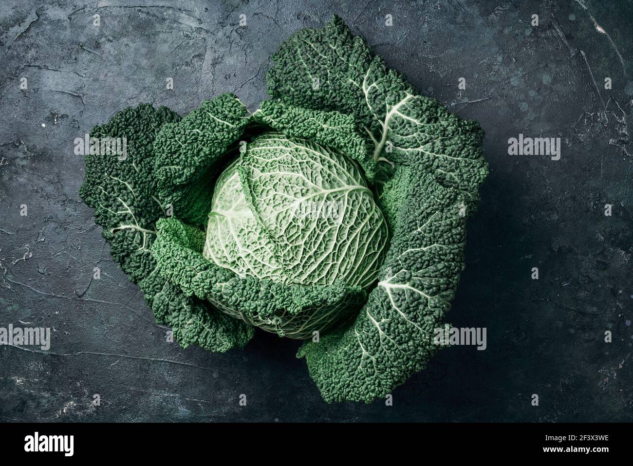 Raw green cabbage texture. Organic savoy cabbage on dark background ...