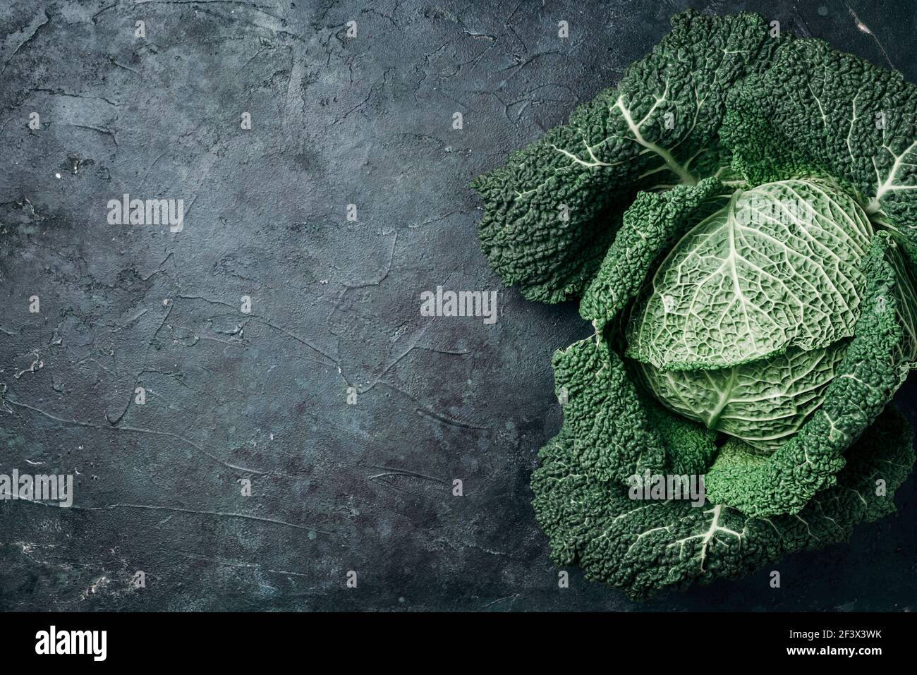 Raw green cabbage texture. Organic savoy cabbage on dark background ...