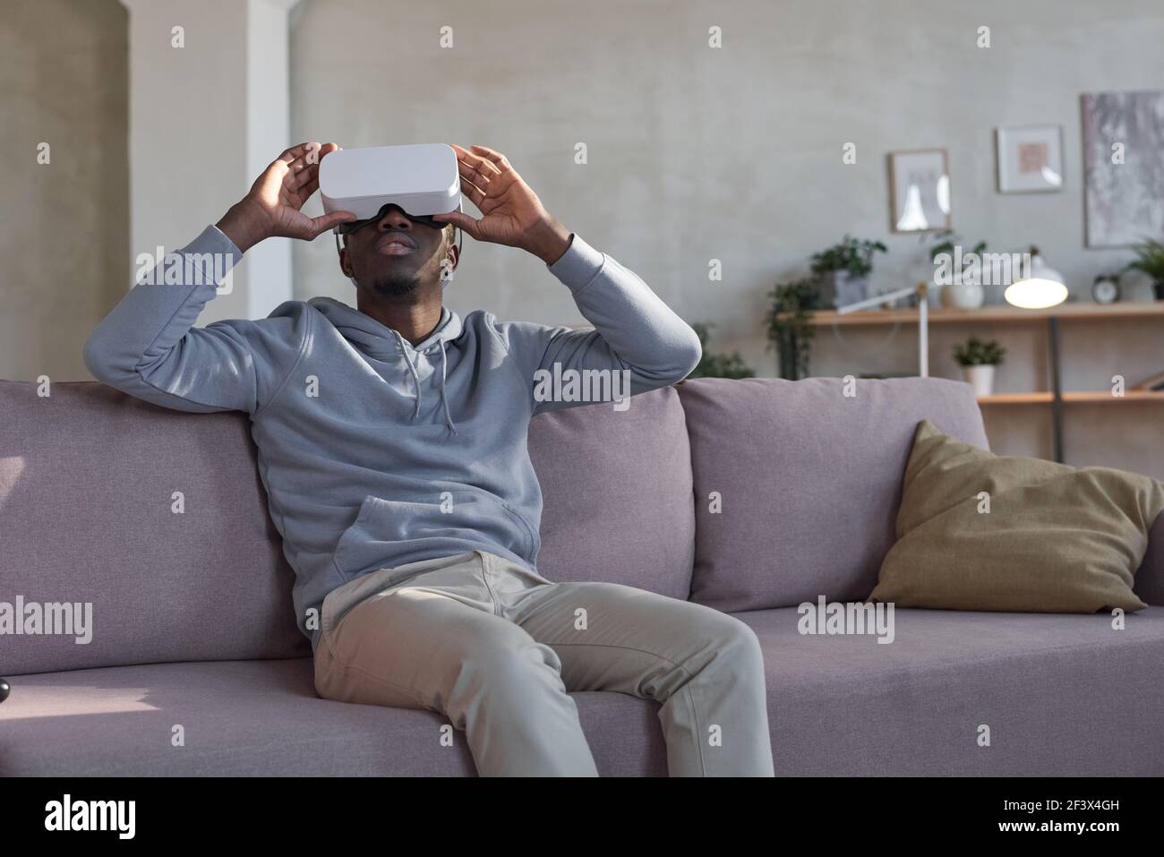 Man playing computer game sitting hi-res stock photography and images ...