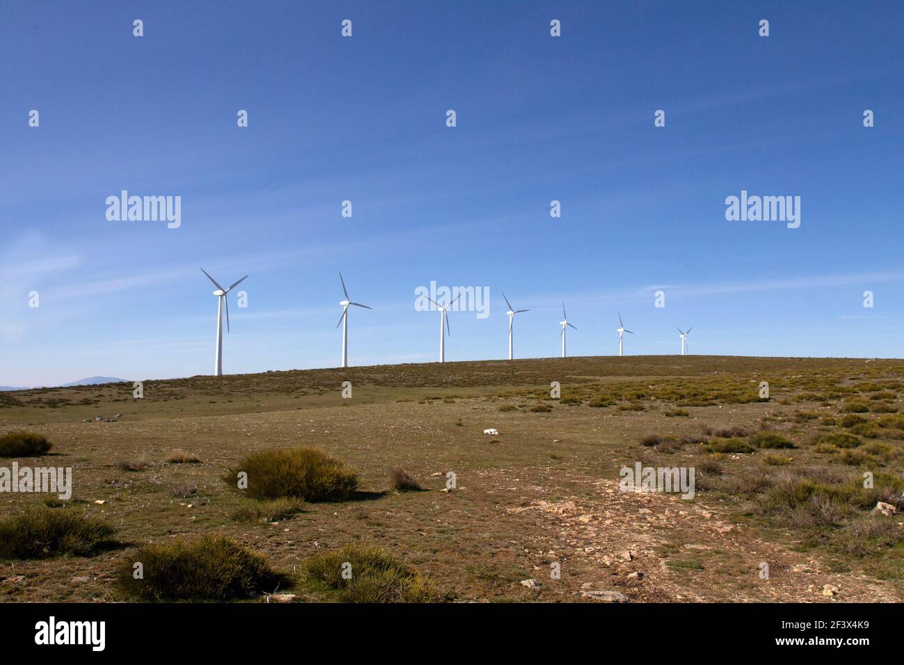 wind turbines producing electricity on a mountain divide in a strong ...