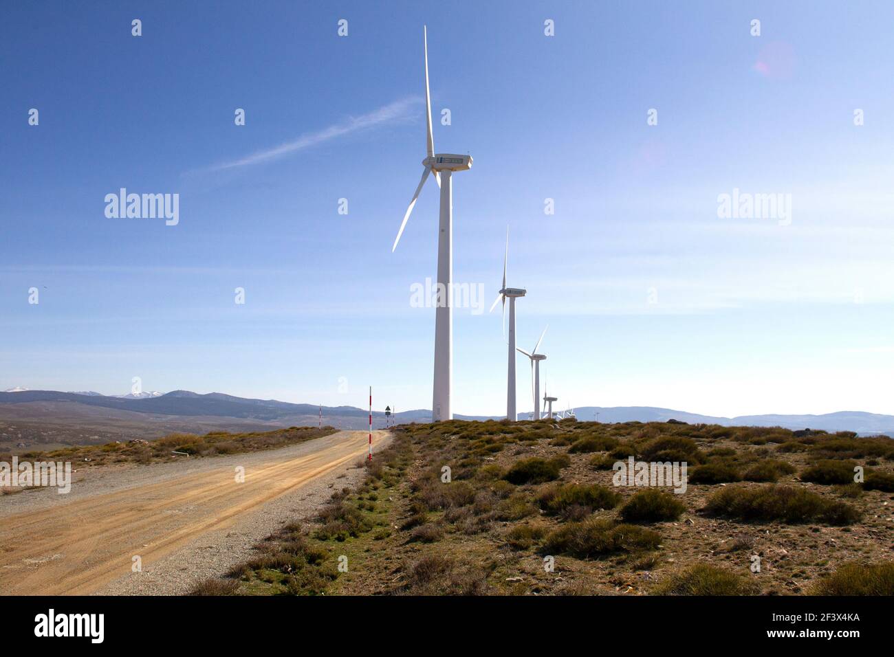 wind turbines producing electricity on a mountain divide in a strong ...