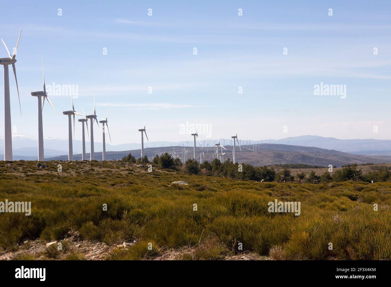 wind turbines producing electricity on a mountain divide in a strong ...