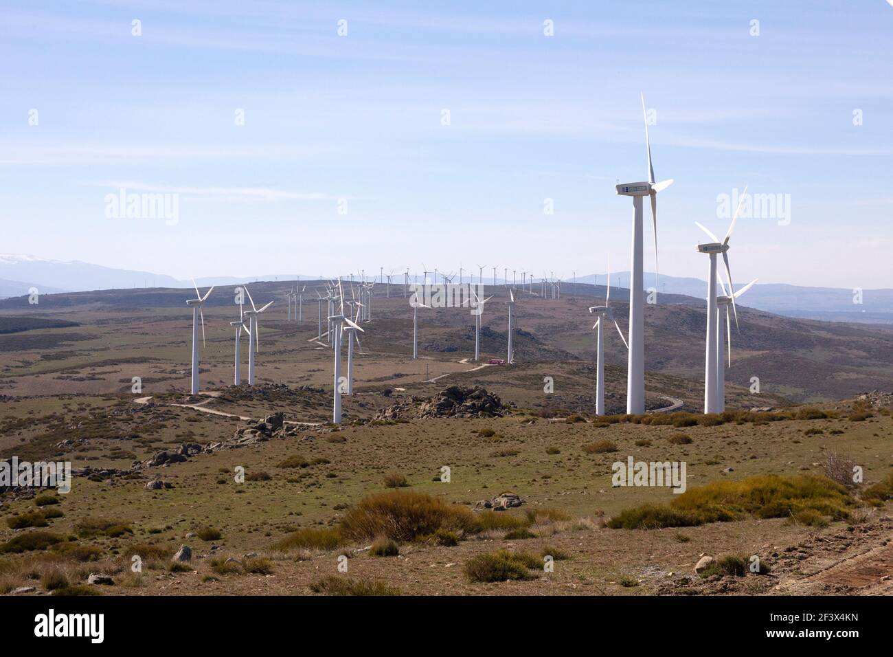 wind turbines producing electricity on a mountain divide in a strong ...