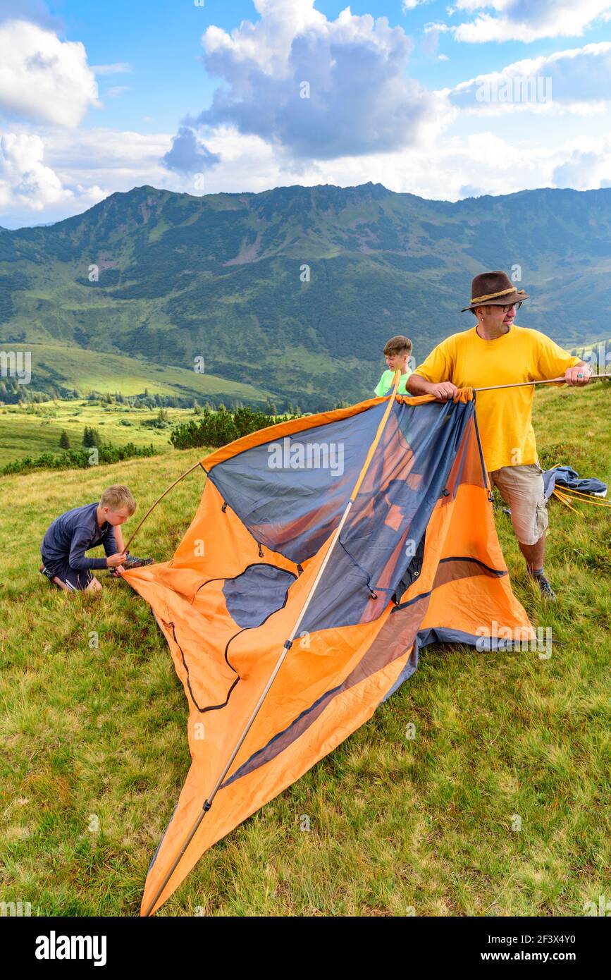 Tent setup for an overnight stay in the mountains Stock Photo - Alamy