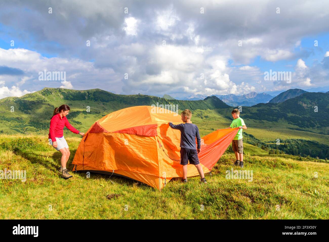 Tent setup for an overnight stay in the mountains Stock Photo - Alamy