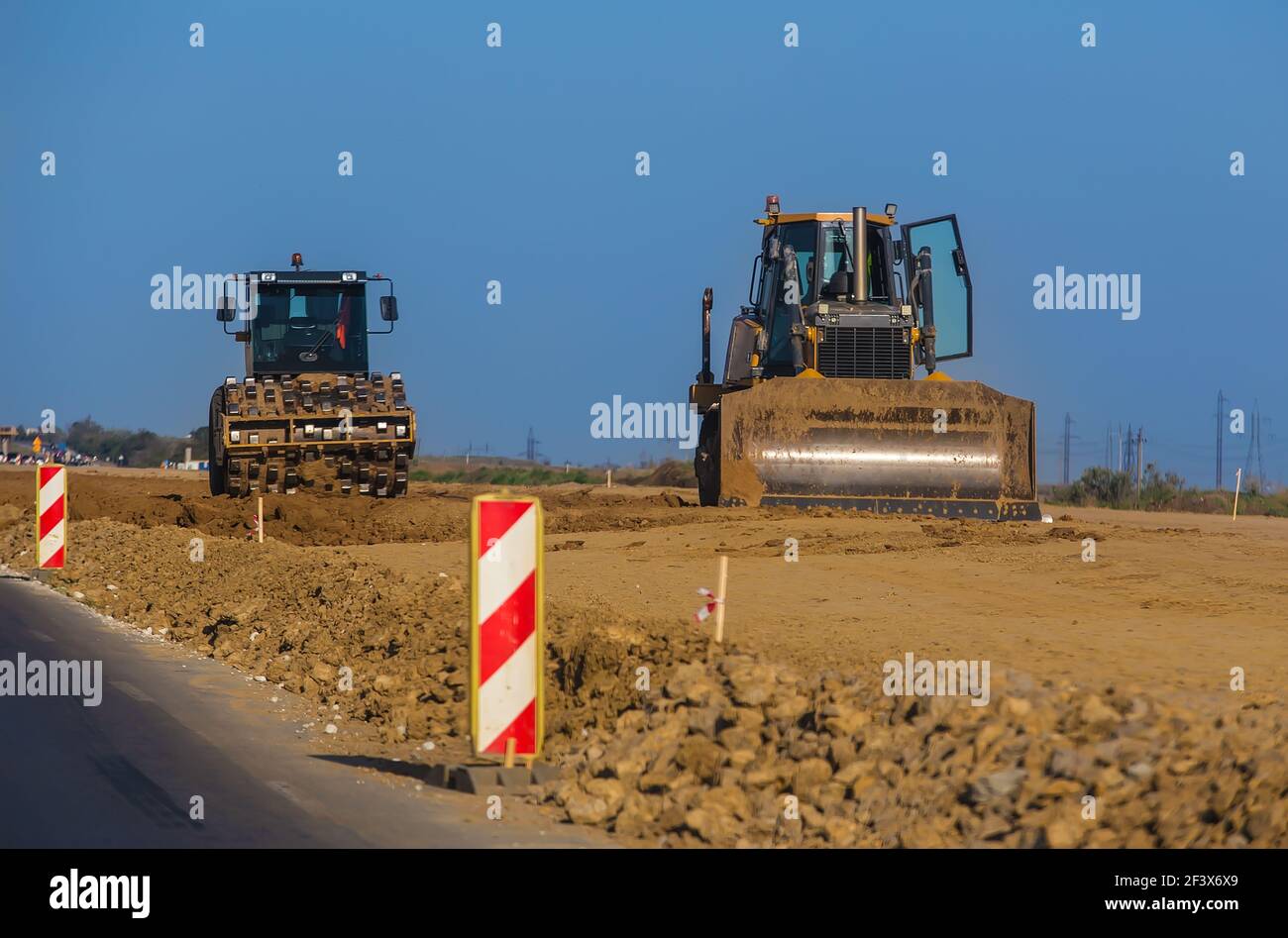 road construction equipment and construction of suburban highway Stock ...