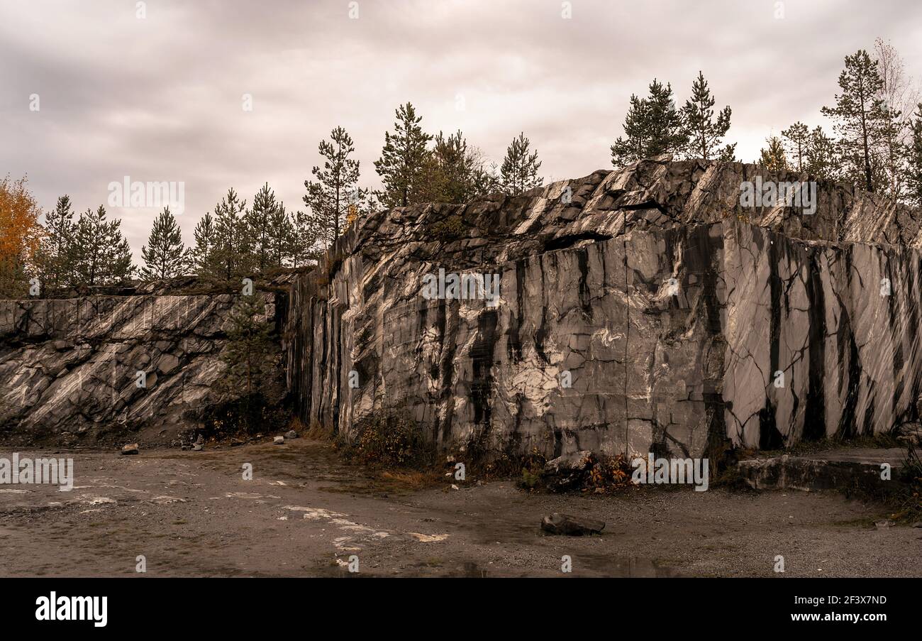 Picturesque natural park landscape with grey and white marble cliff and ...