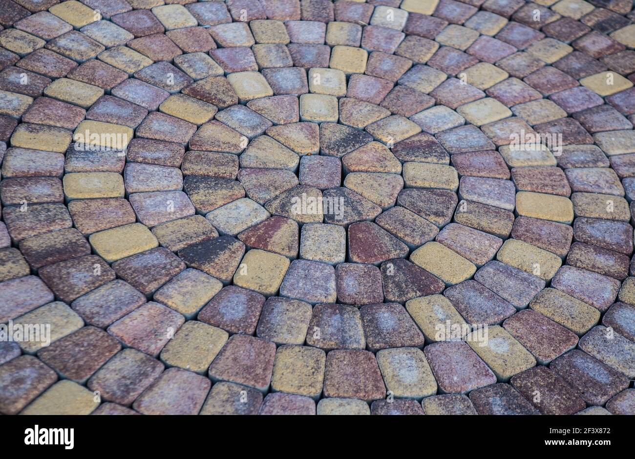 pavement of rough granite tiles in radial packing Stock Photo - Alamy