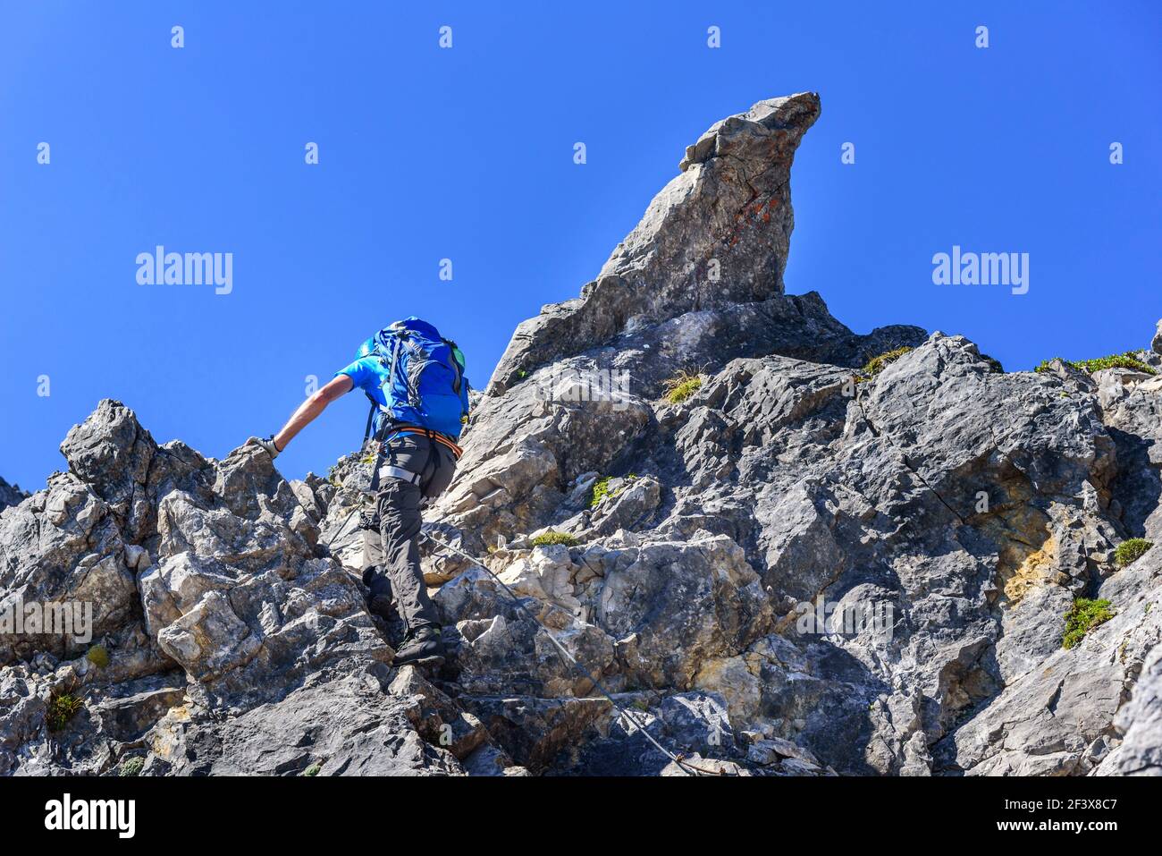 Via Ferrata climbing in high alpine region Stock Photo - Alamy