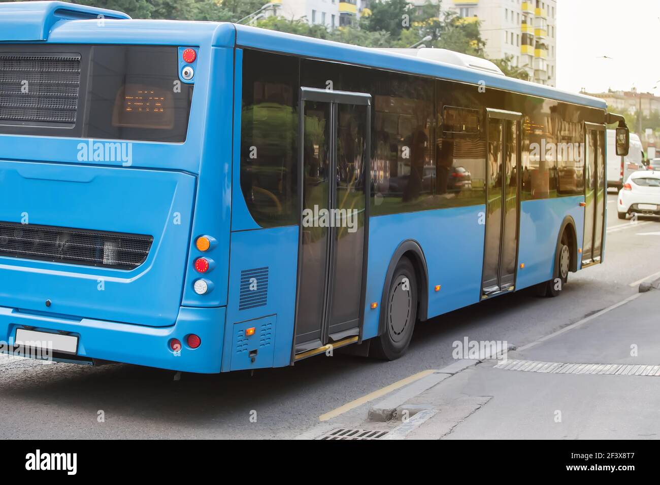 city bus goes along street Stock Photo - Alamy